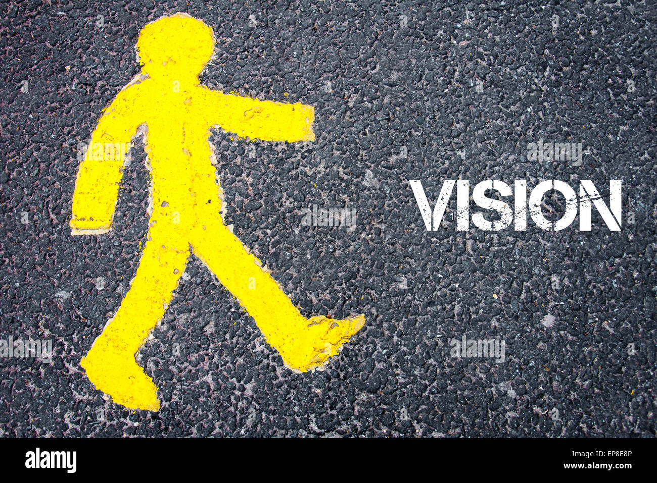 Yellow pedestrian figure on the road walking towards VISION. Conceptual ...