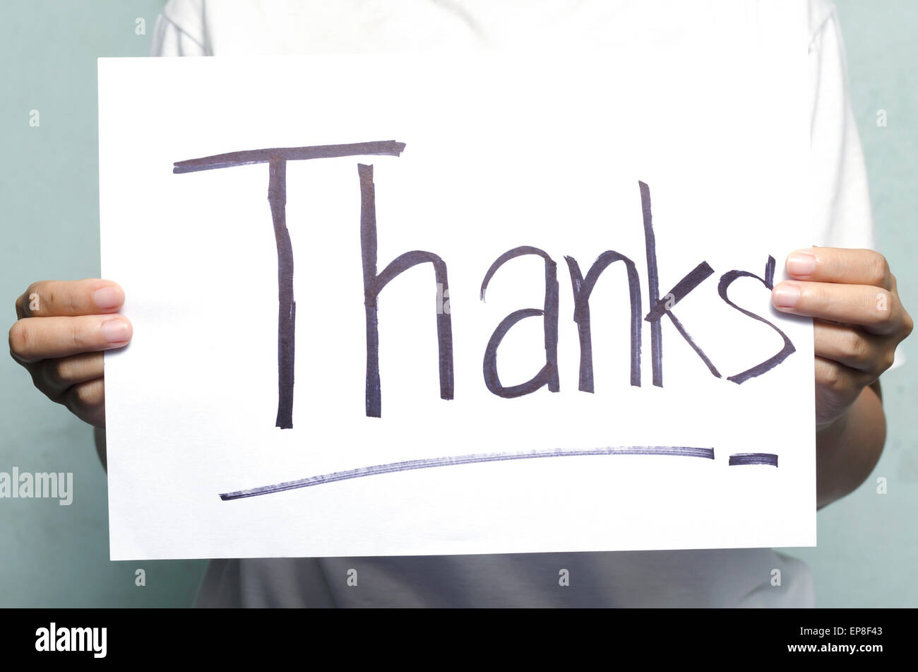 two woman hand holding paper write thanks word Stock Photo - Alamy
