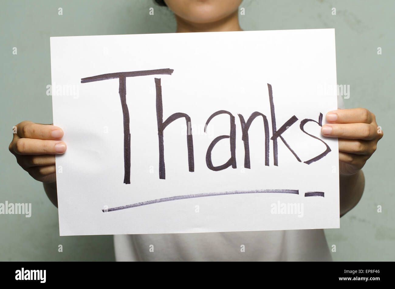 two woman hand holding paper write thanks word Stock Photo - Alamy