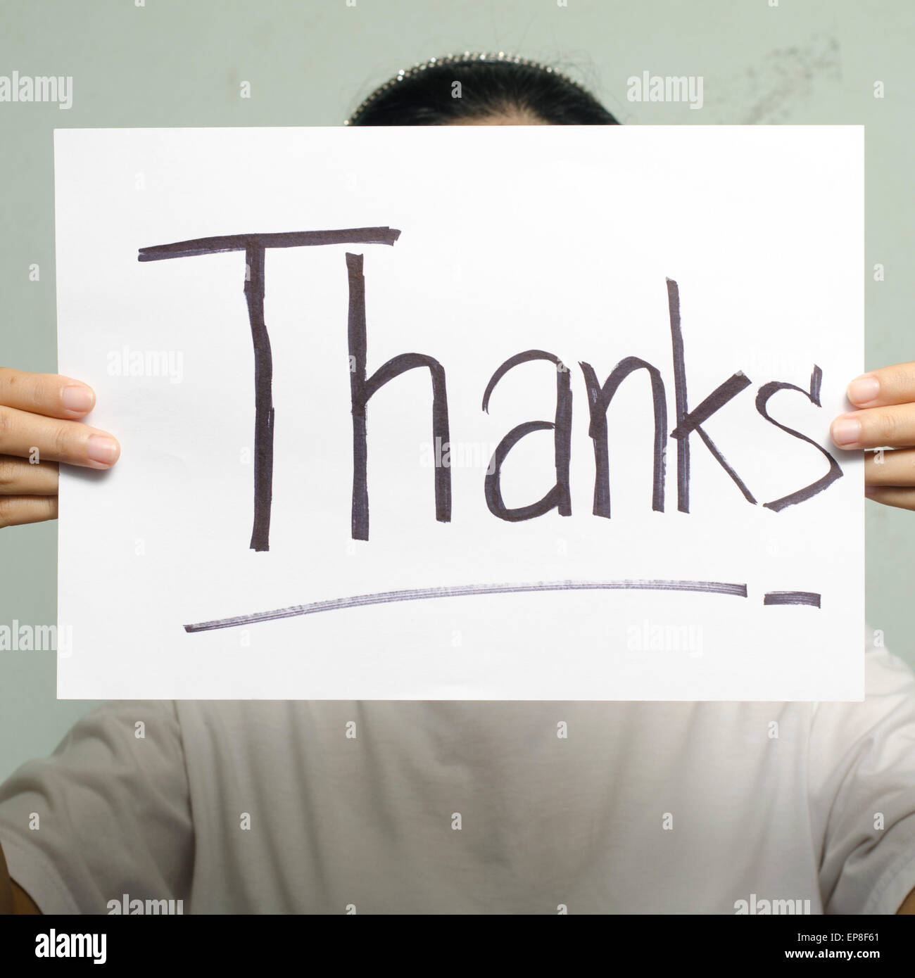 two woman hand holding paper write thanks word Stock Photo - Alamy