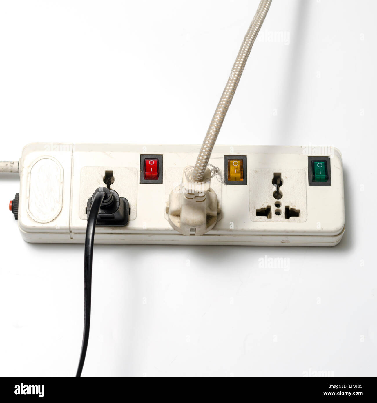 electric multiple socket outlet on a white background Stock Photo - Alamy