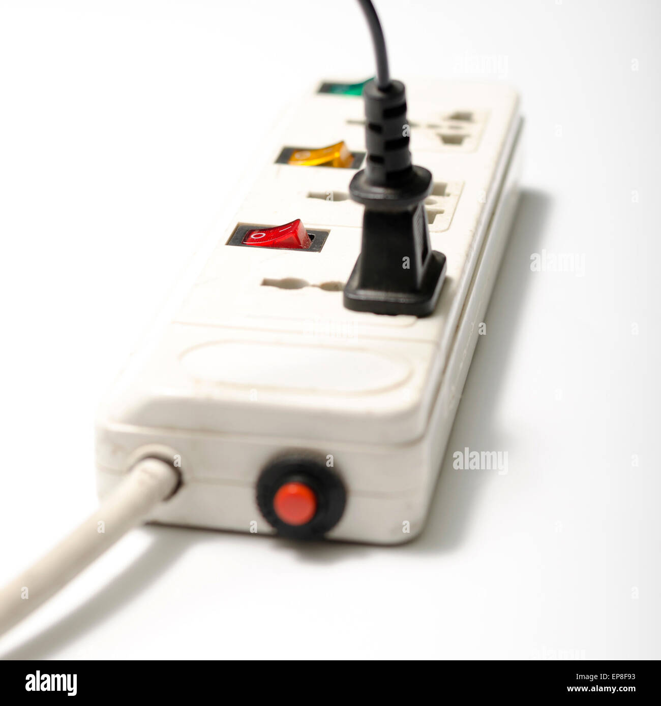 electric multiple socket outlet on a white background Stock Photo - Alamy