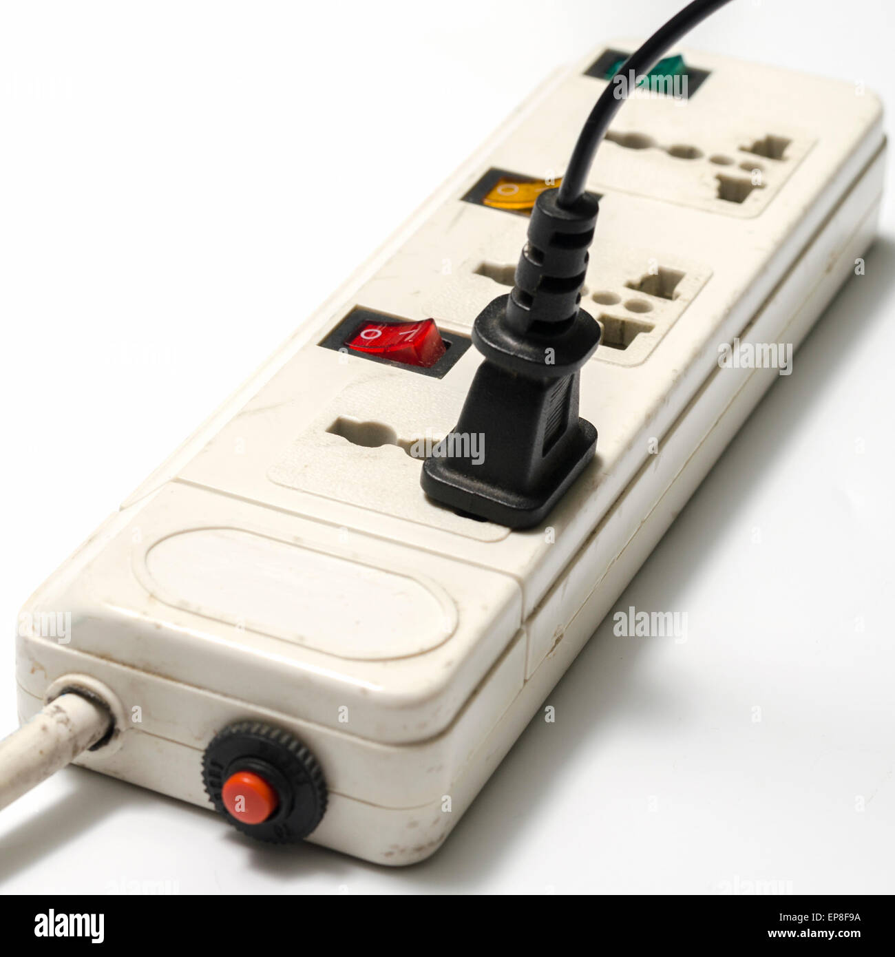 electric multiple socket outlet on a white background Stock Photo - Alamy