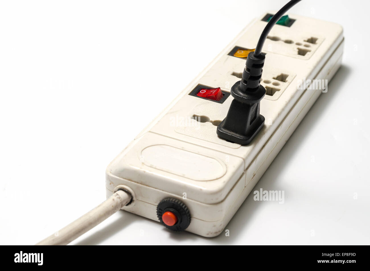 electric multiple socket outlet on a white background Stock Photo - Alamy
