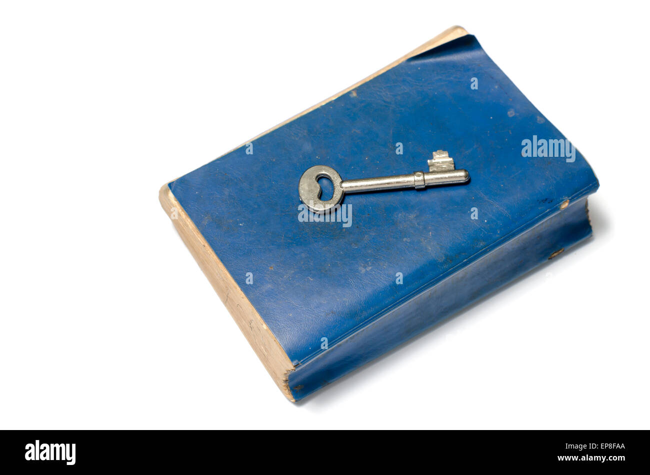 blue color old book with key on a white background Stock Photo - Alamy