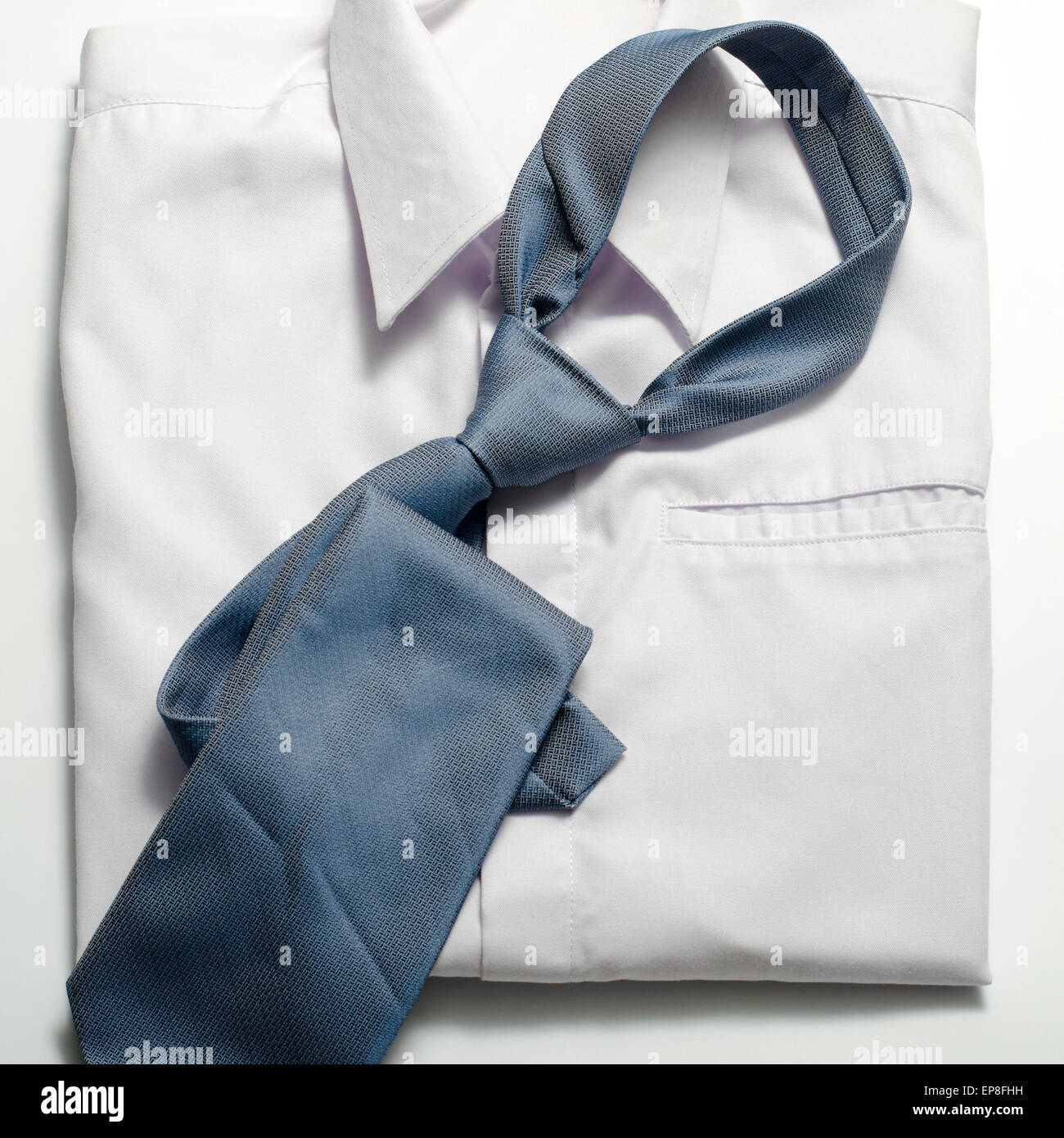 cloth white shirt with blue neck tie Stock Photo - Alamy