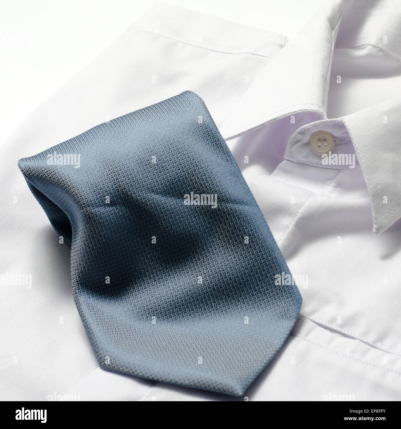 cloth white shirt with blue neck tie Stock Photo - Alamy