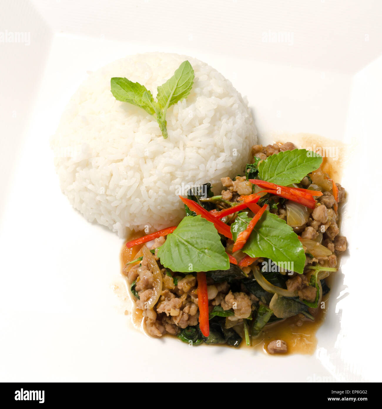 Thai main food Rice topped with stir-fried pork and basil Stock Photo ...