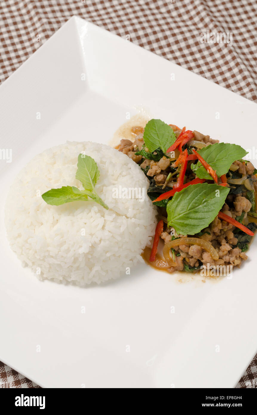Thai main food Rice topped with stir-fried pork and basil Stock Photo ...