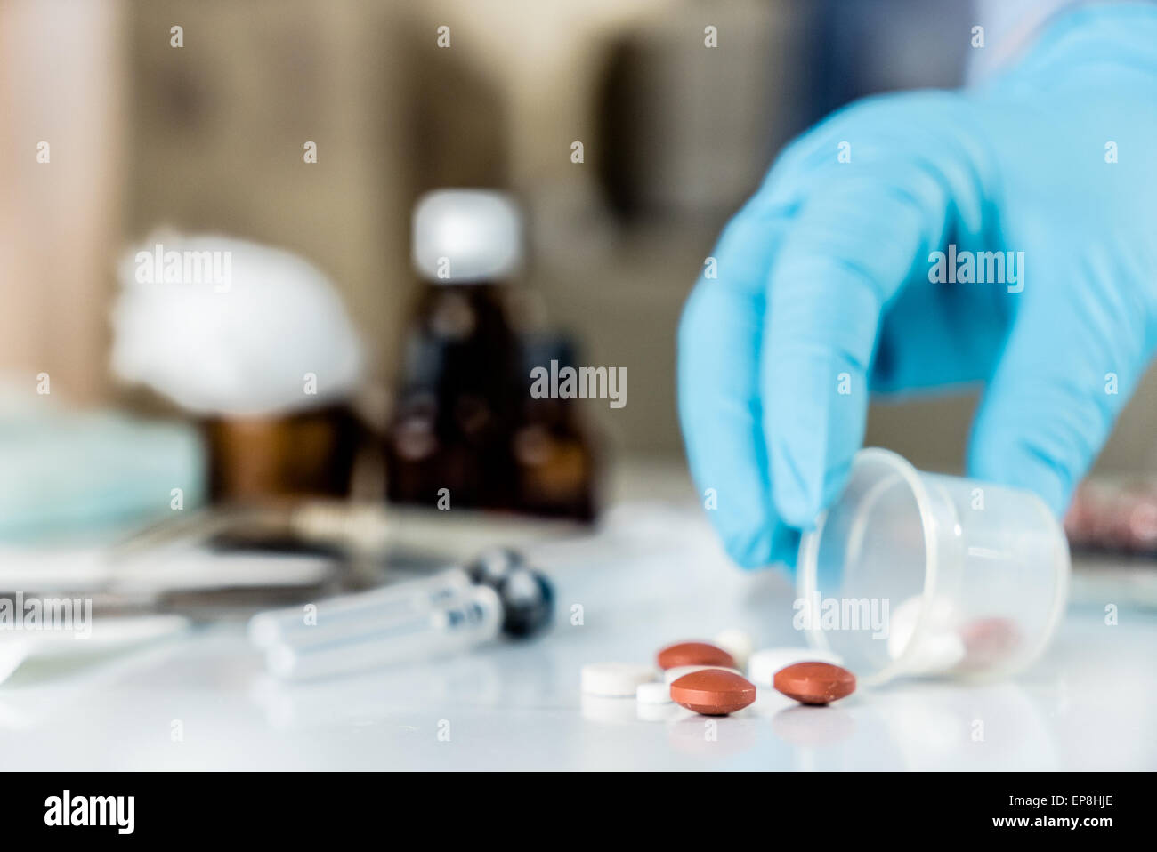 Drugs in a measuring cylinder Stock Photo - Alamy