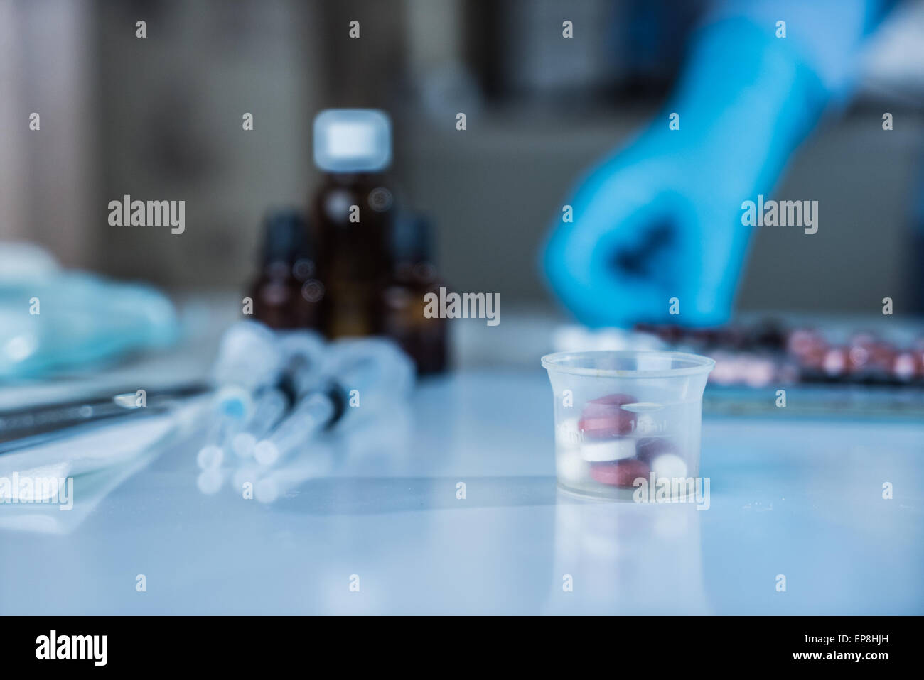 Drugs in a measuring cylinder Stock Photo - Alamy
