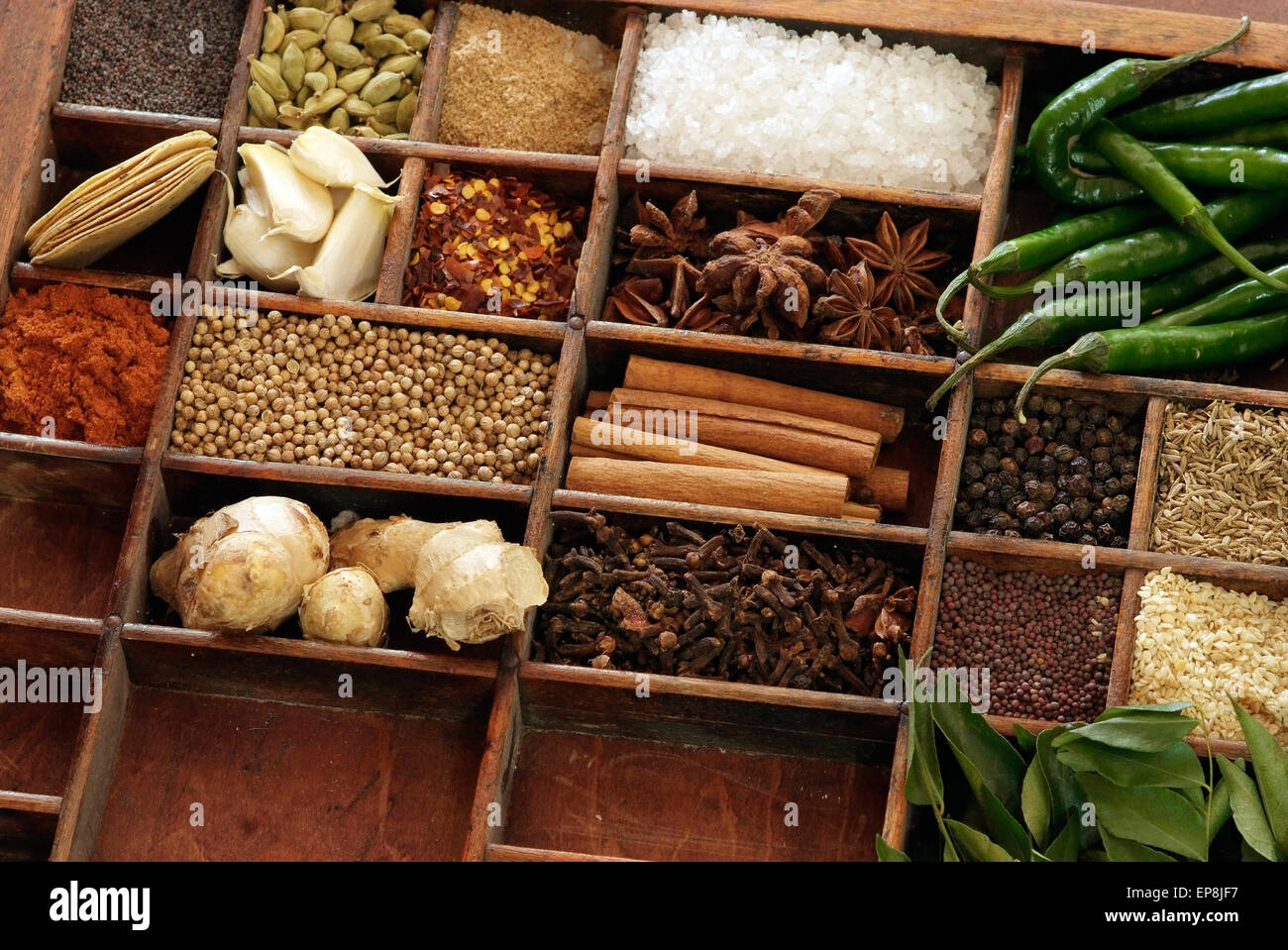 Spice tray full of spices used in the making of curry Stock Photo - Alamy