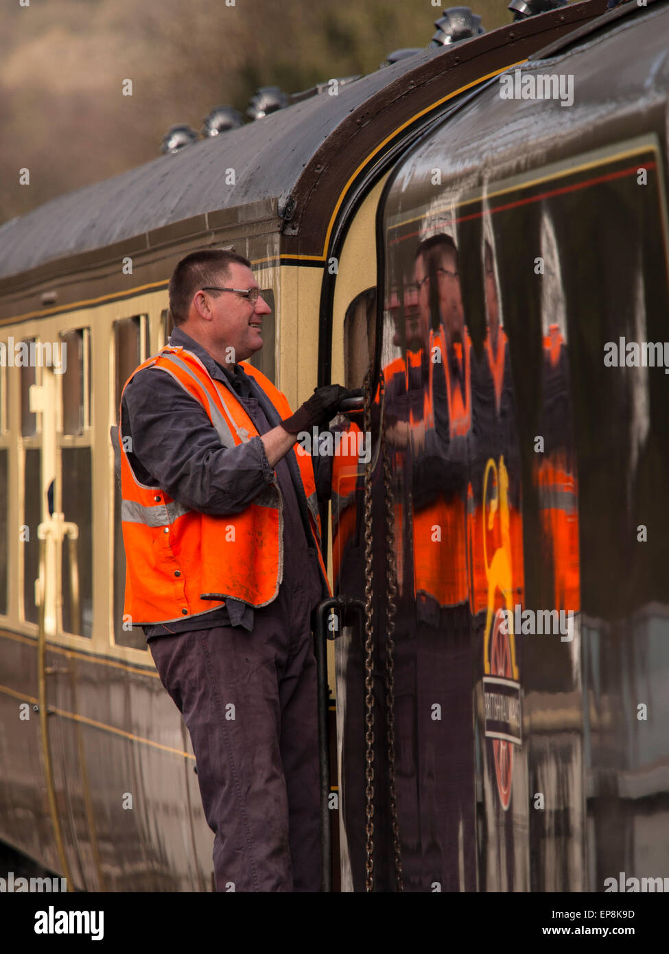 train driver climbs on board steam locomotive at Grosmont station,on ...