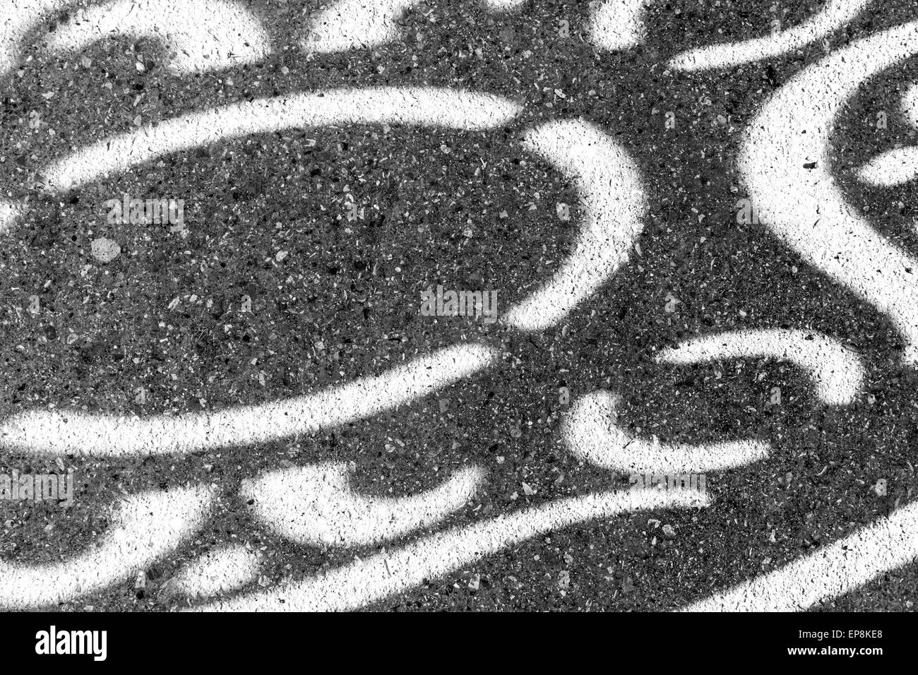 Shadows cast from a cast iron ornate fence on gravel Stock Photo - Alamy