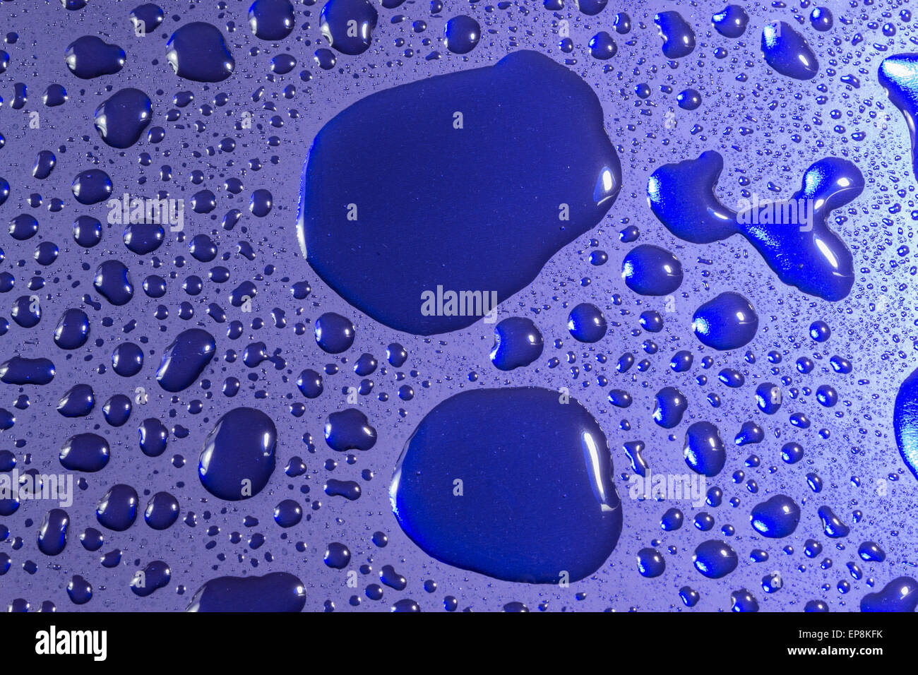 Cold water droplets reflected from the surface of turquoise metal Stock ...