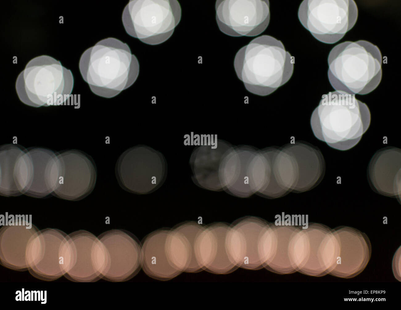 Fading white and Orange bokeh blurred light effect using a black ...