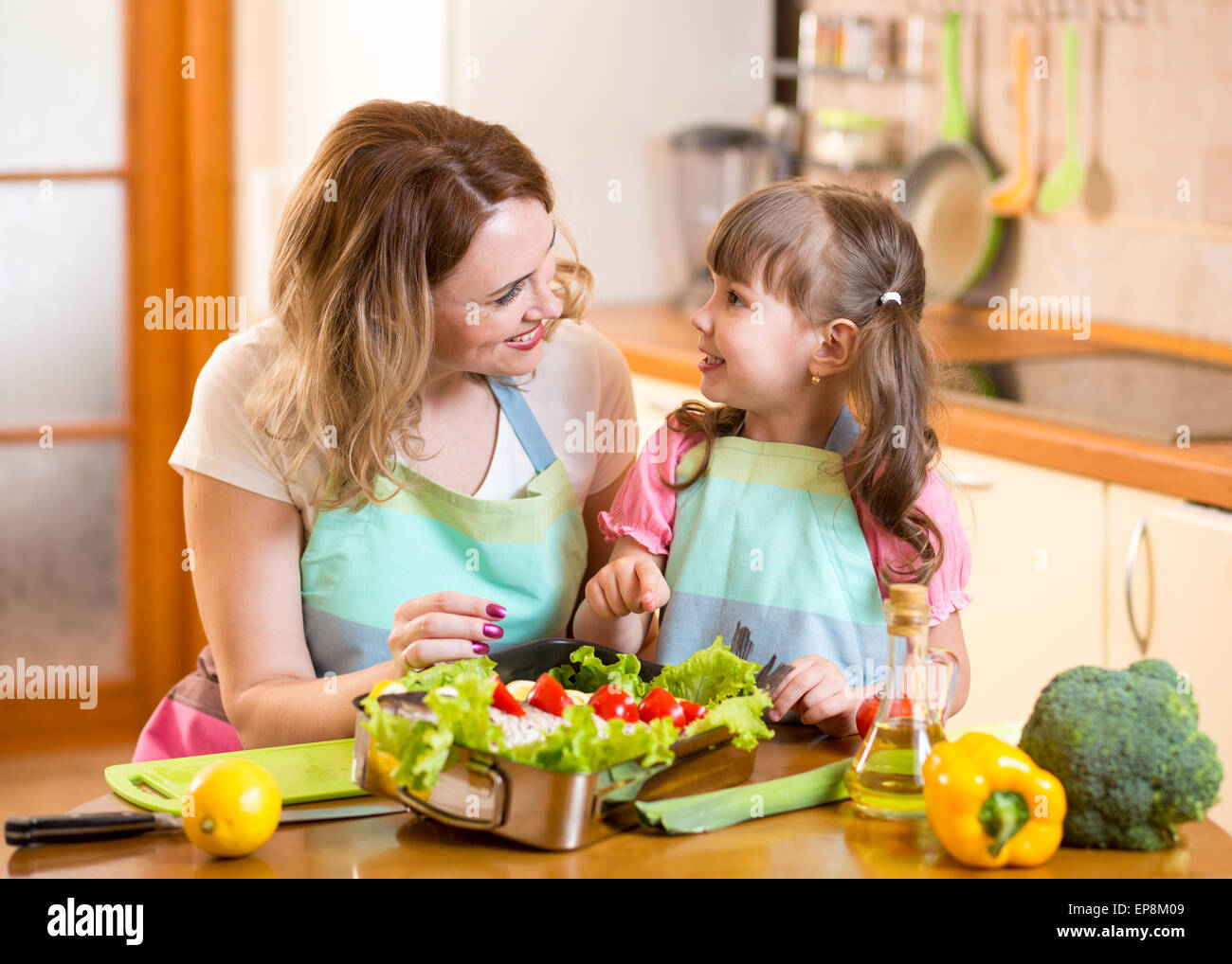 mother and kid cooking and having fun in kitchen Stock Photo - Alamy