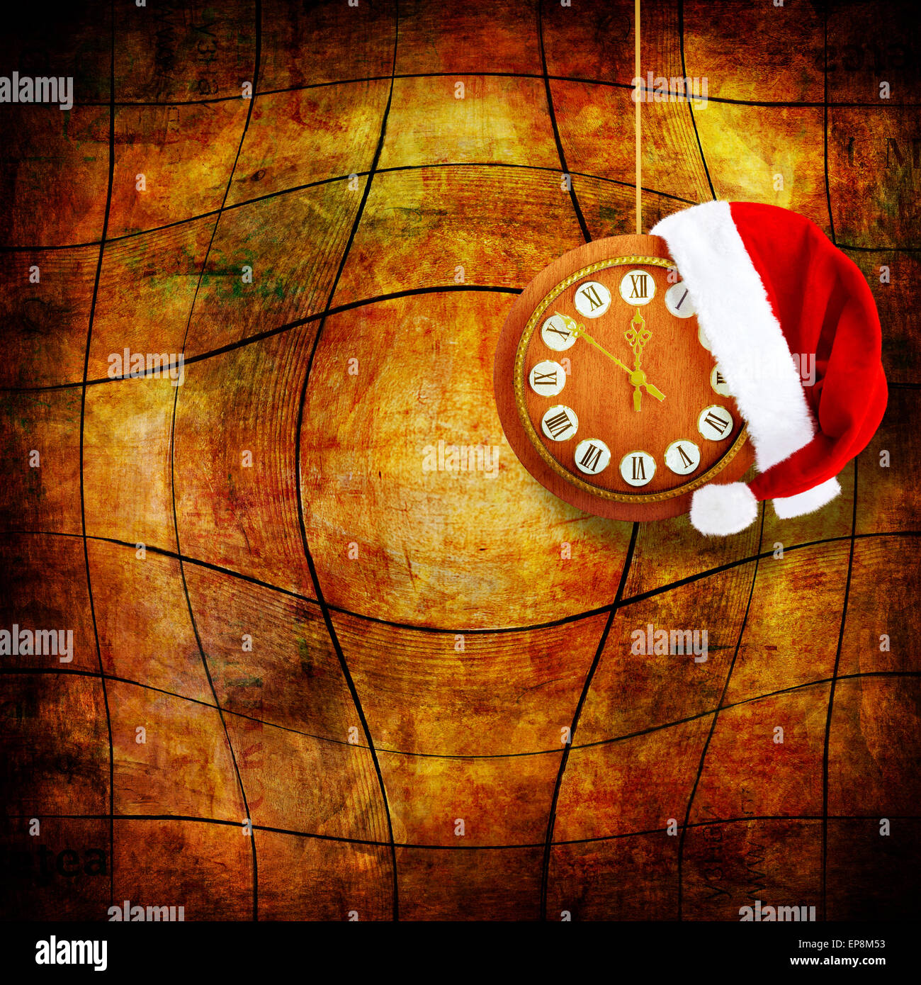 Santa Claus hat on New Year's night on the old clock showing twelve o ...