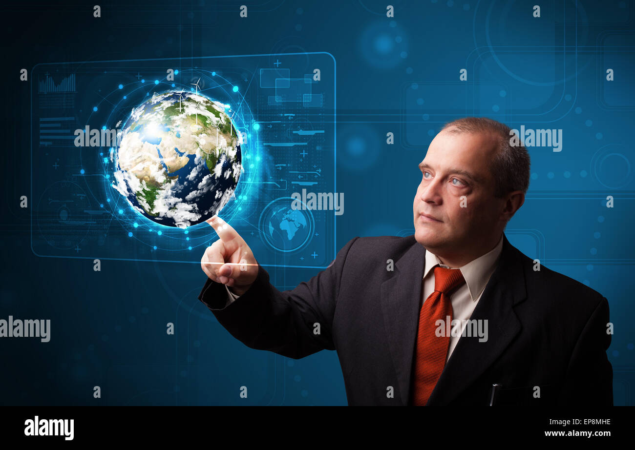 Businessman touching high-tech 3d earth panel Stock Photo - Alamy