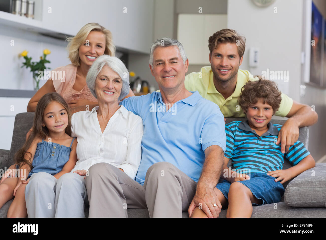 Multi-generation family posing in the living room Stock Photo - Alamy