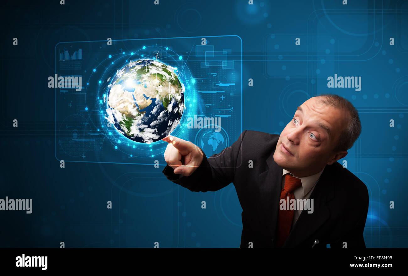 Businessman touching high-tech 3d earth panel Stock Photo - Alamy