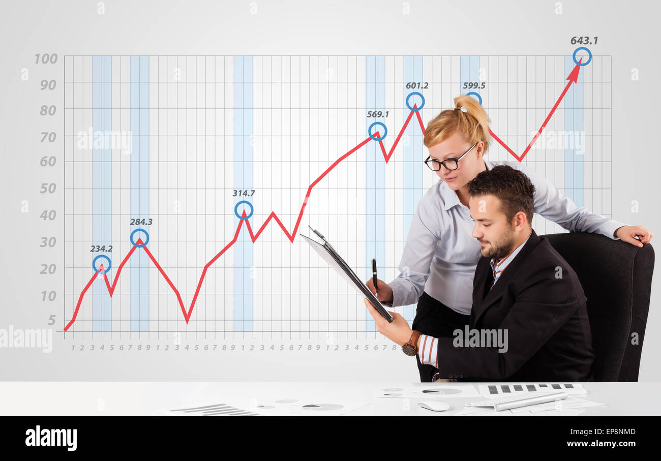 Businessman and businesswoman calculating stock market with rising ...