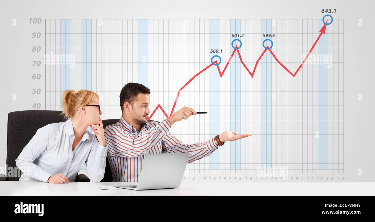 Businessman and businesswoman calculating stock market with rising ...