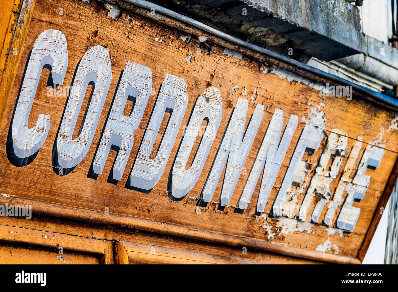Faded peeling paint Cordonnerie shop sign - France Stock Photo - Alamy