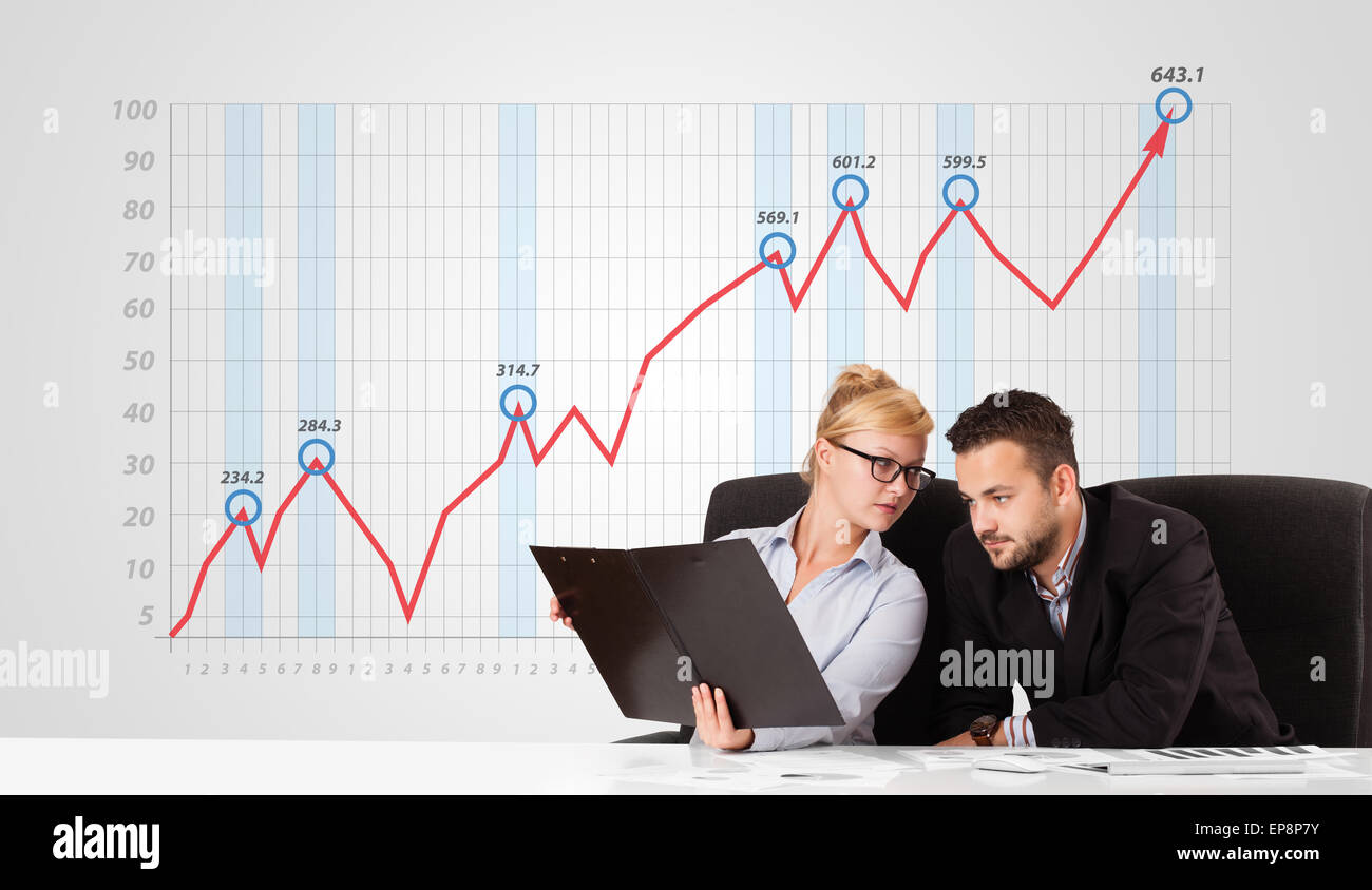 Businessman and businesswoman calculating stock market with rising ...
