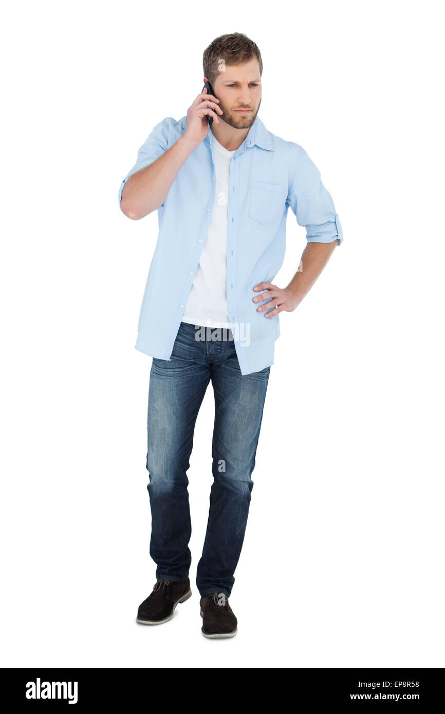 Serious model posing while having a phone call Stock Photo - Alamy