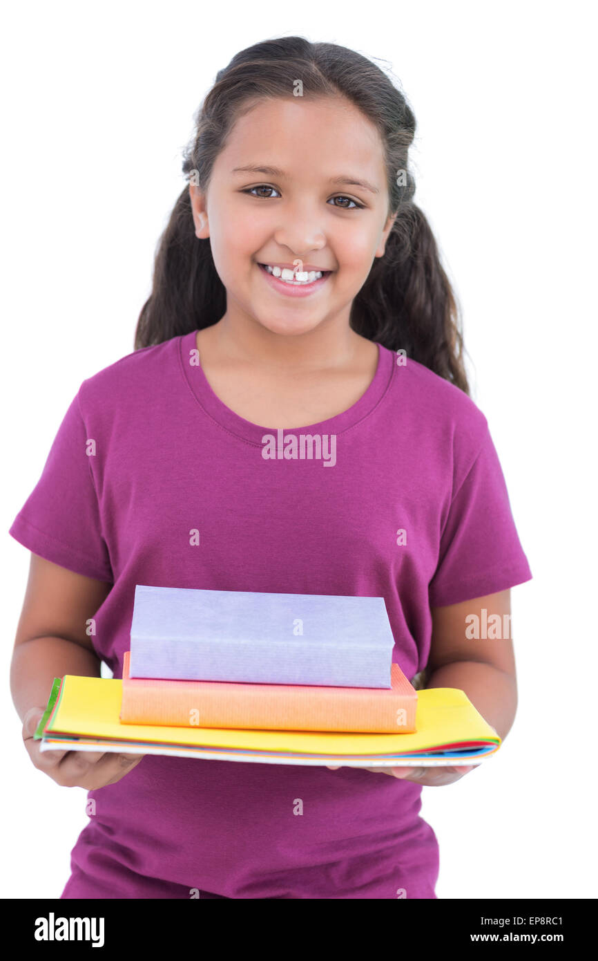 Little girl holding notebooks and books for her homework Stock Photo ...