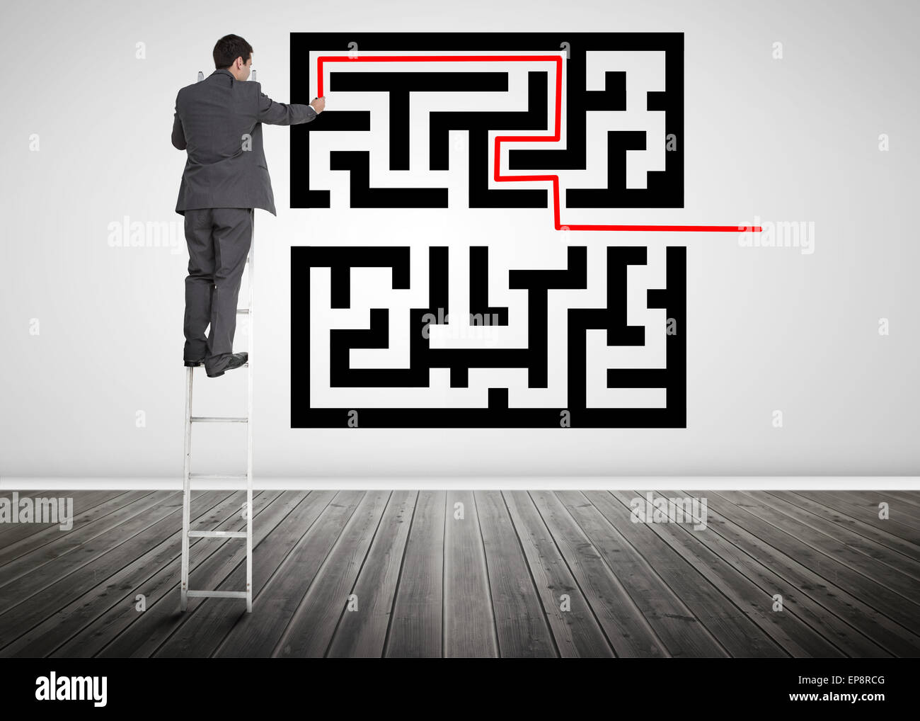 Businessman standing on a ladder drawing line through qr code Stock ...