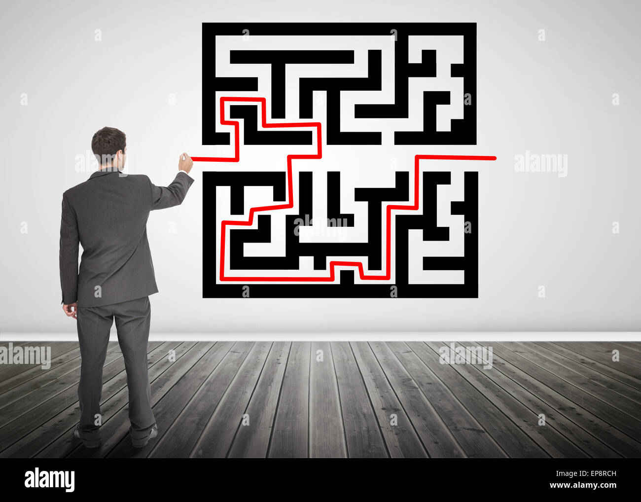 Businessman drawing a red line through qr code Stock Photo - Alamy