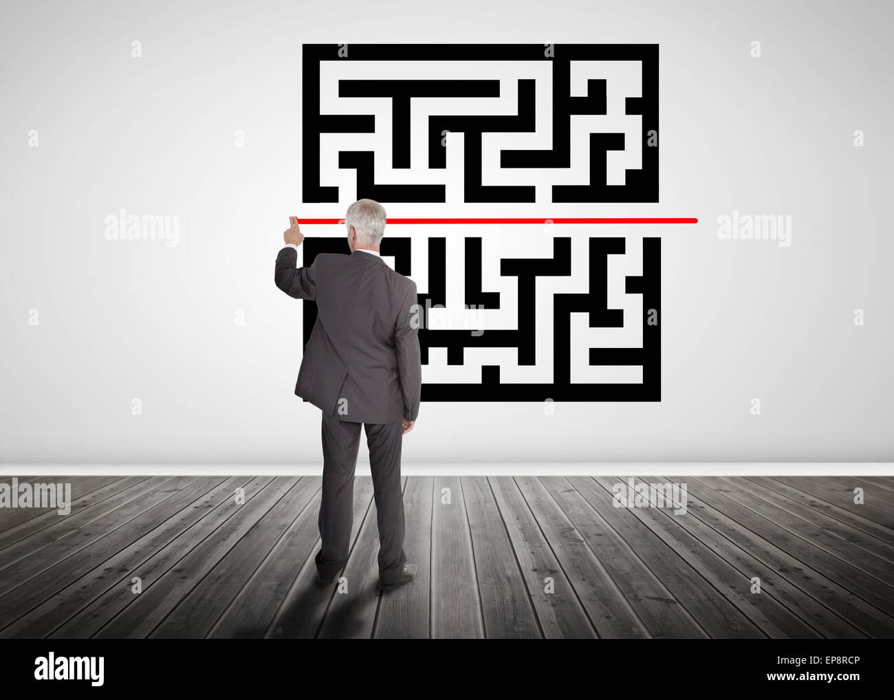 Businessman drawing red line through quick response code Stock Photo ...