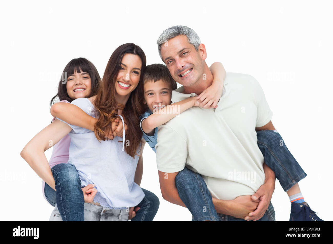 Smiling parents holding their children on backs Stock Photo - Alamy