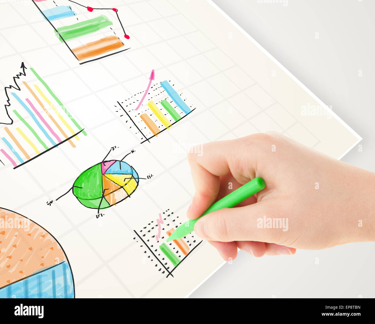 Business person drawing colorful graphs and icons on paper Stock Photo ...