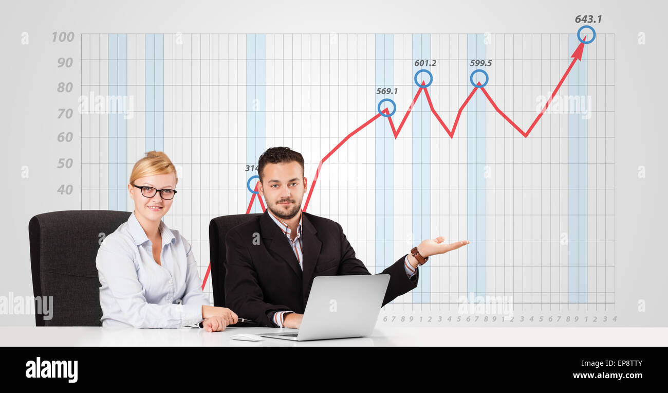 Businessman and businesswoman calculating stock market with rising ...