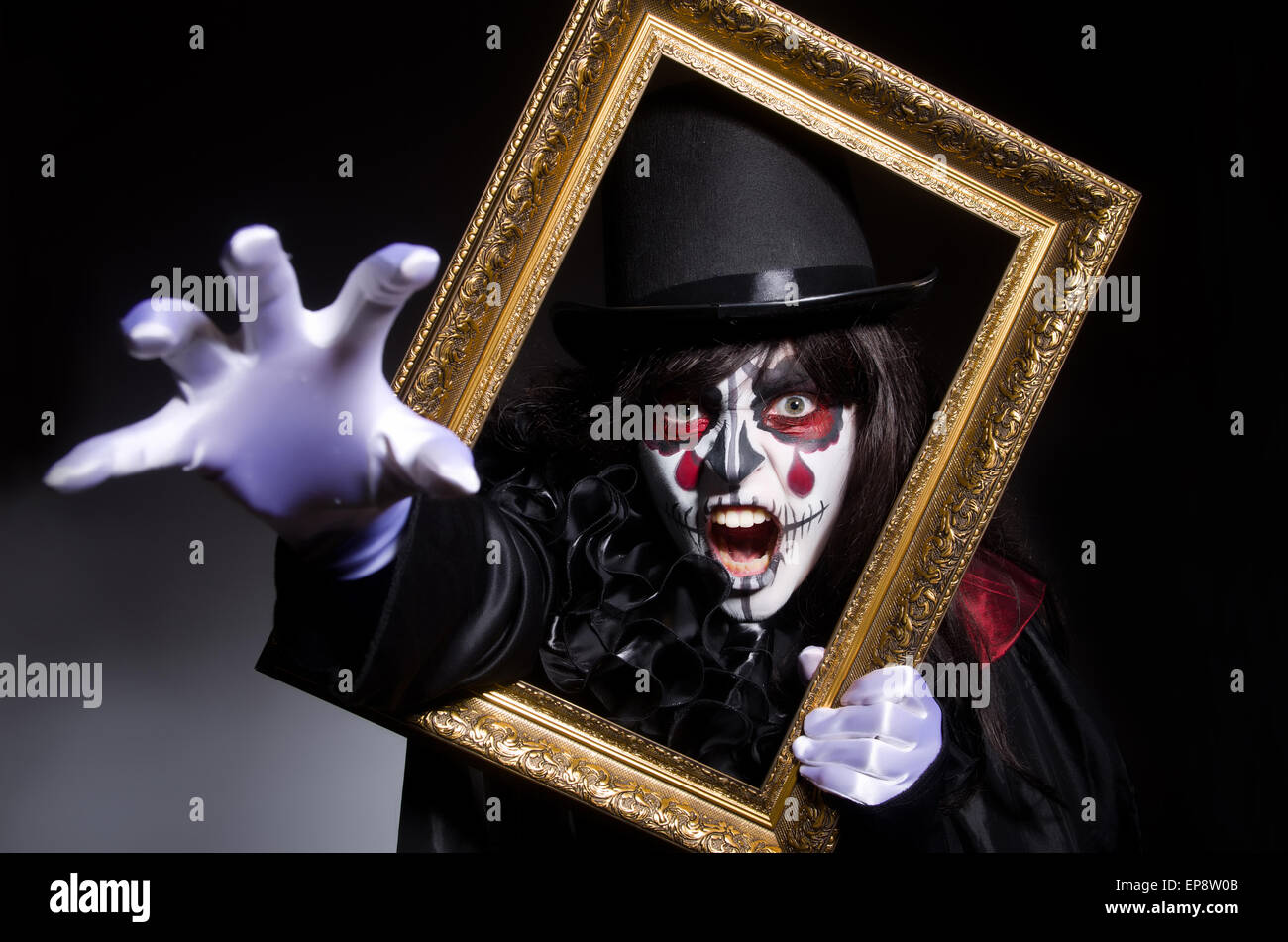 Monster with picture photo frame in dark room0 Stock Photo - Alamy