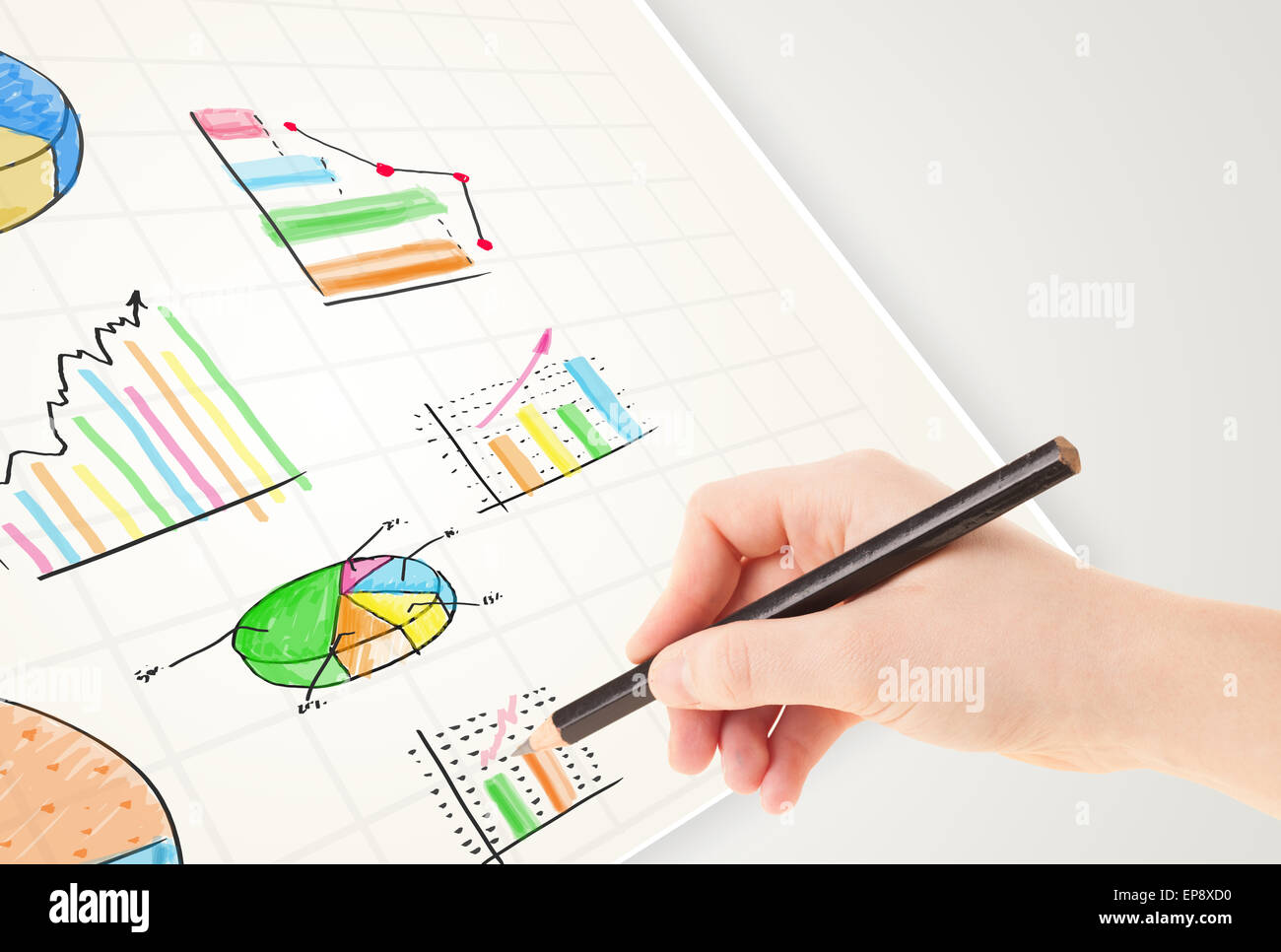 Business person drawing colorful graphs and icons on paper Stock Photo ...