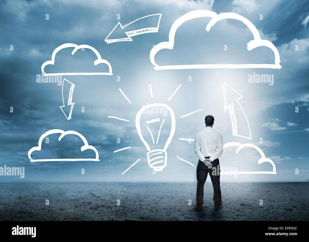 Businessman considering cloud computing graphics with light bulb Stock ...