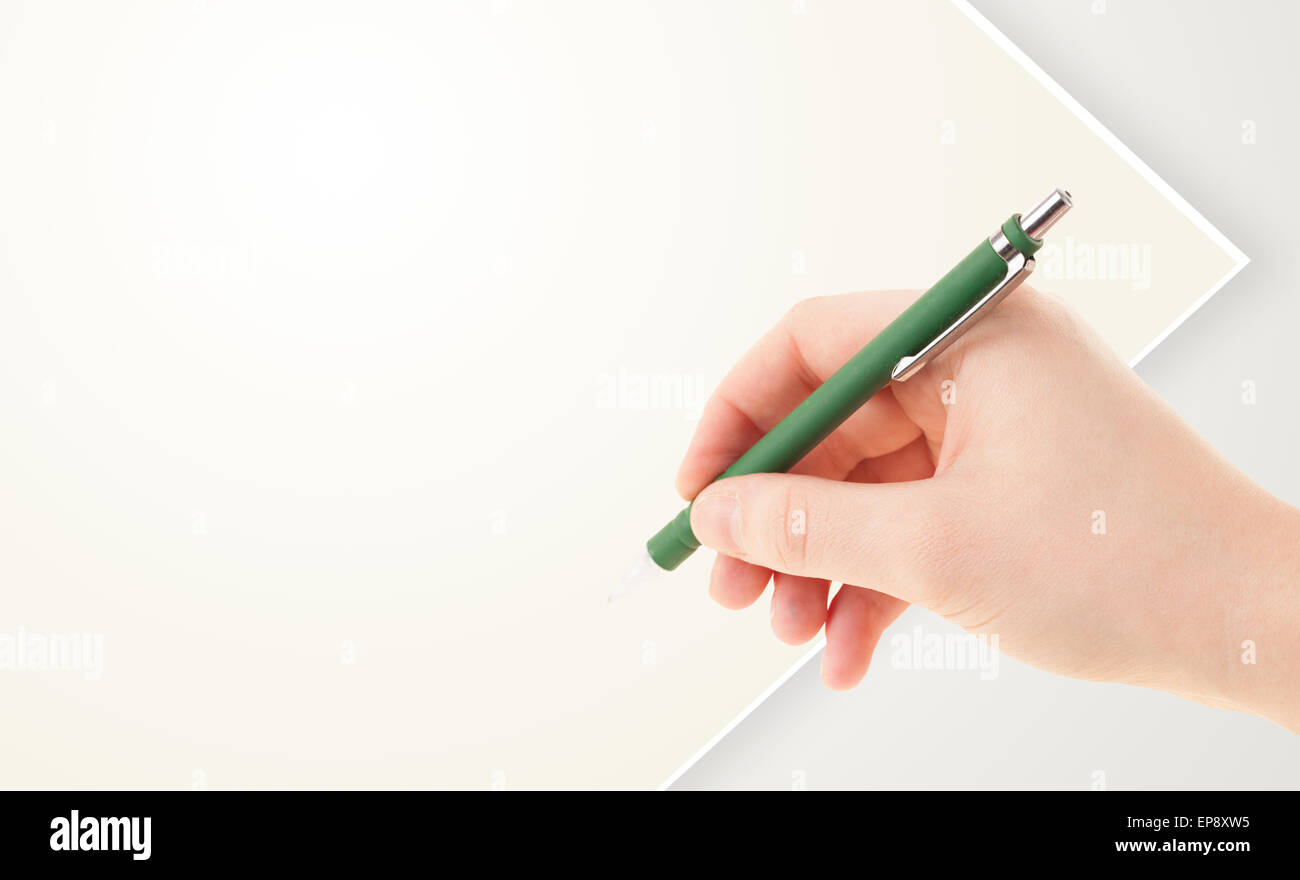 Hand writing on plain empty white paper copy space Stock Photo - Alamy