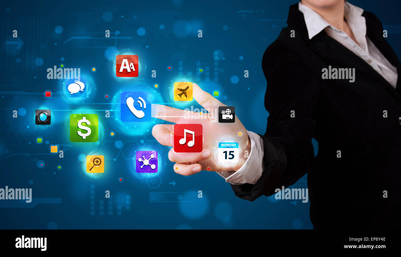 Woman pressing various collection of high tech buttons Stock Photo - Alamy