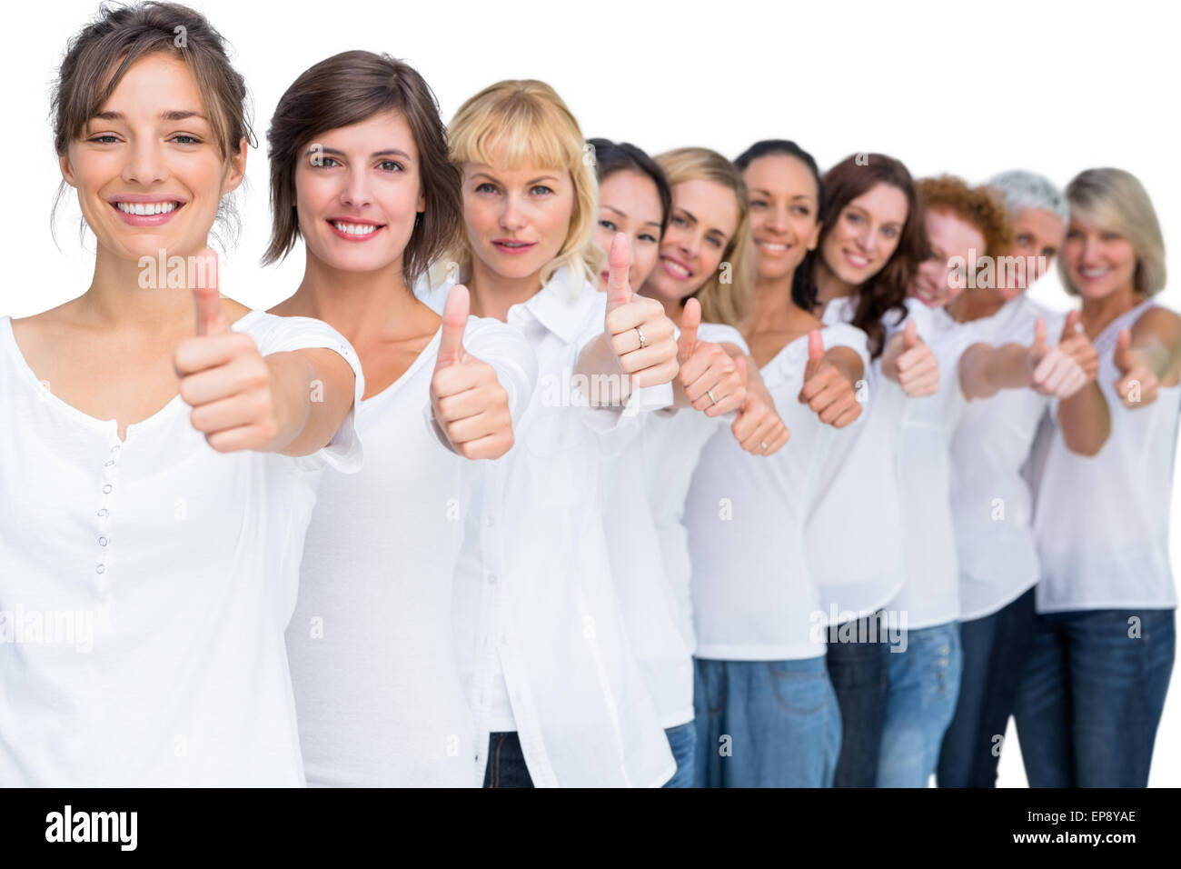 Cheerful casual models posing in a line thumbs up Stock Photo - Alamy