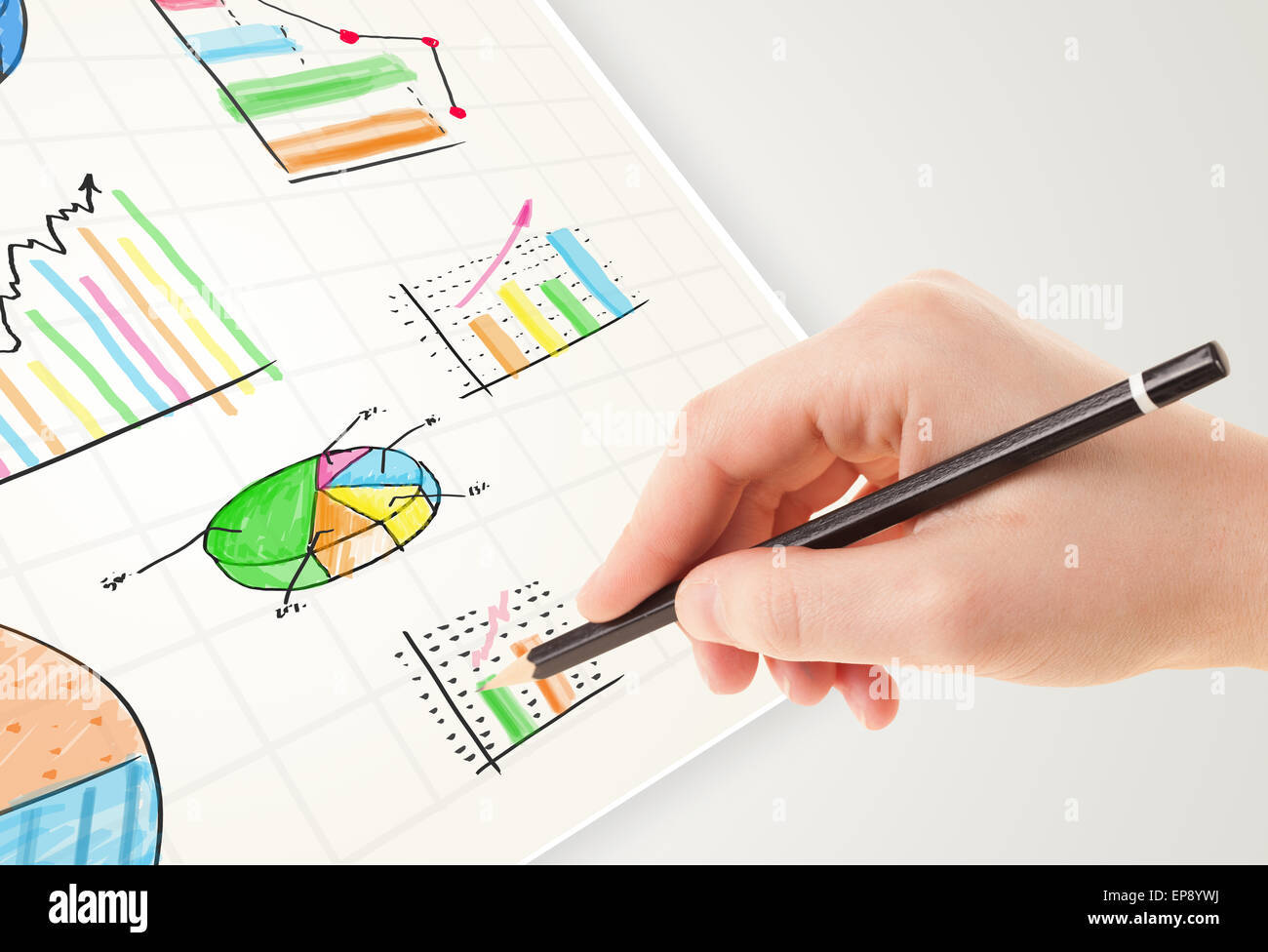 Business person drawing colorful graphs and icons on paper Stock Photo ...