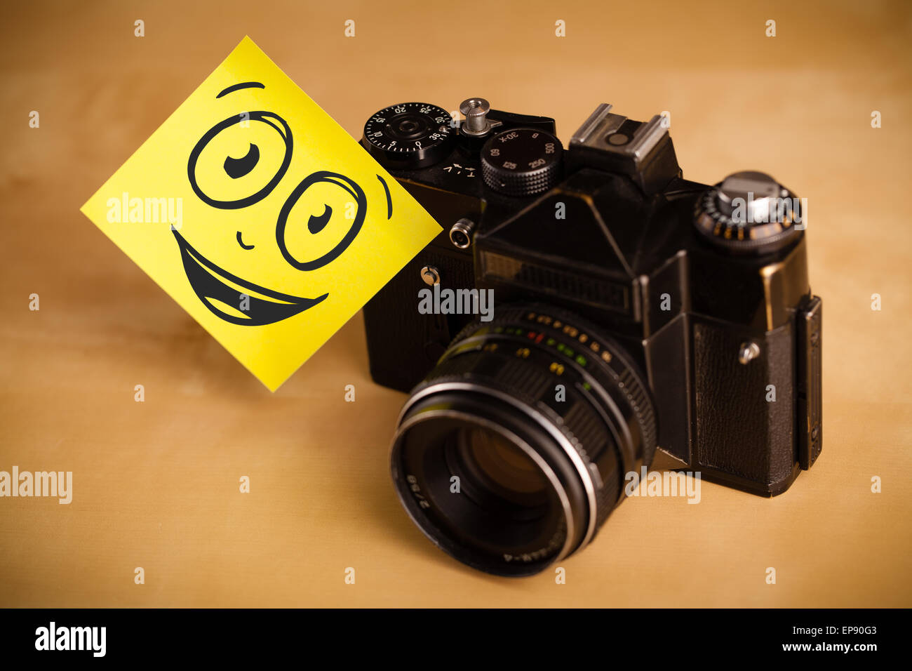 Post-it note with smiley face sticked on photo camera Stock Photo - Alamy