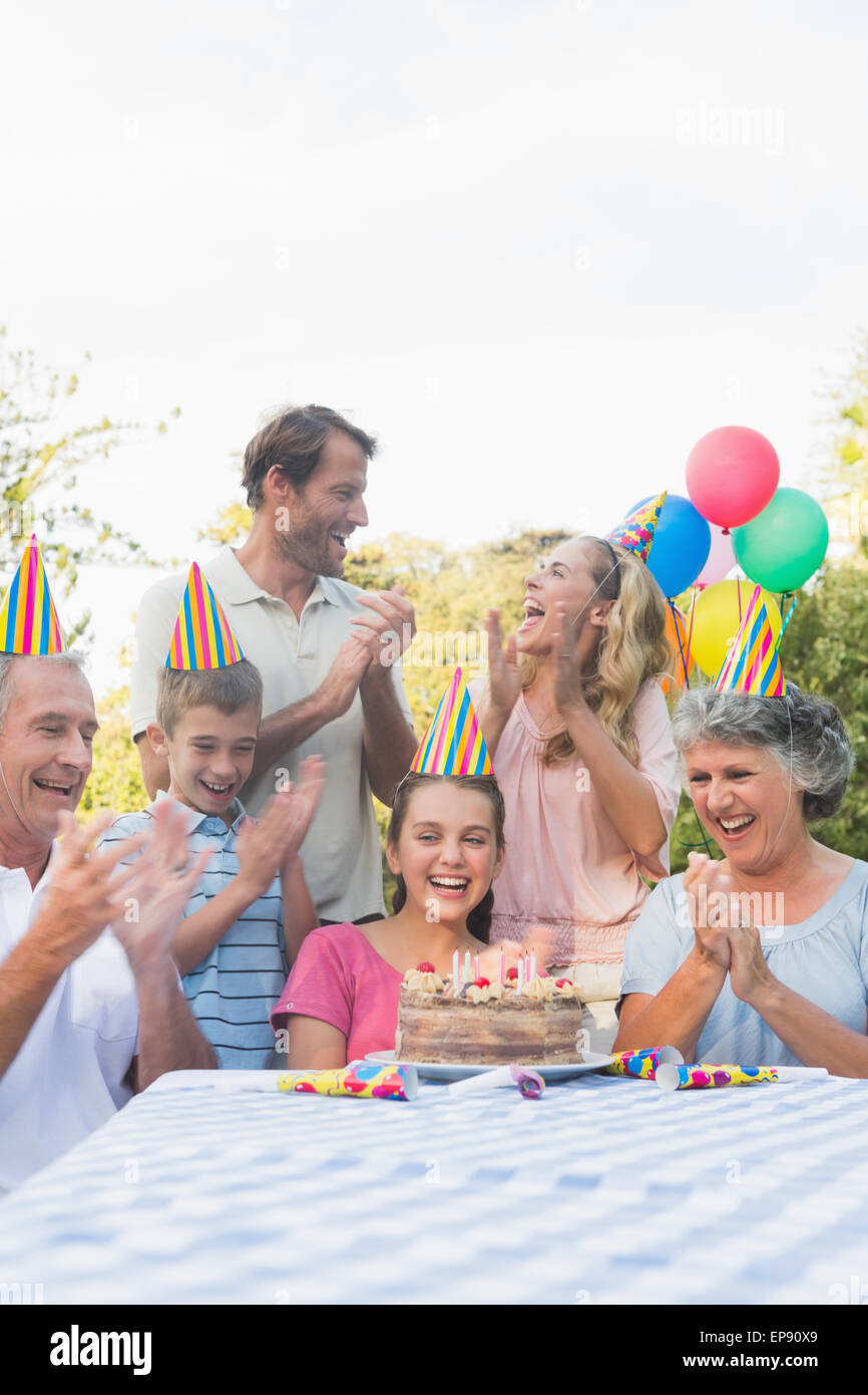 Cheerful extended family clapping for little girls birthday Stock Photo ...