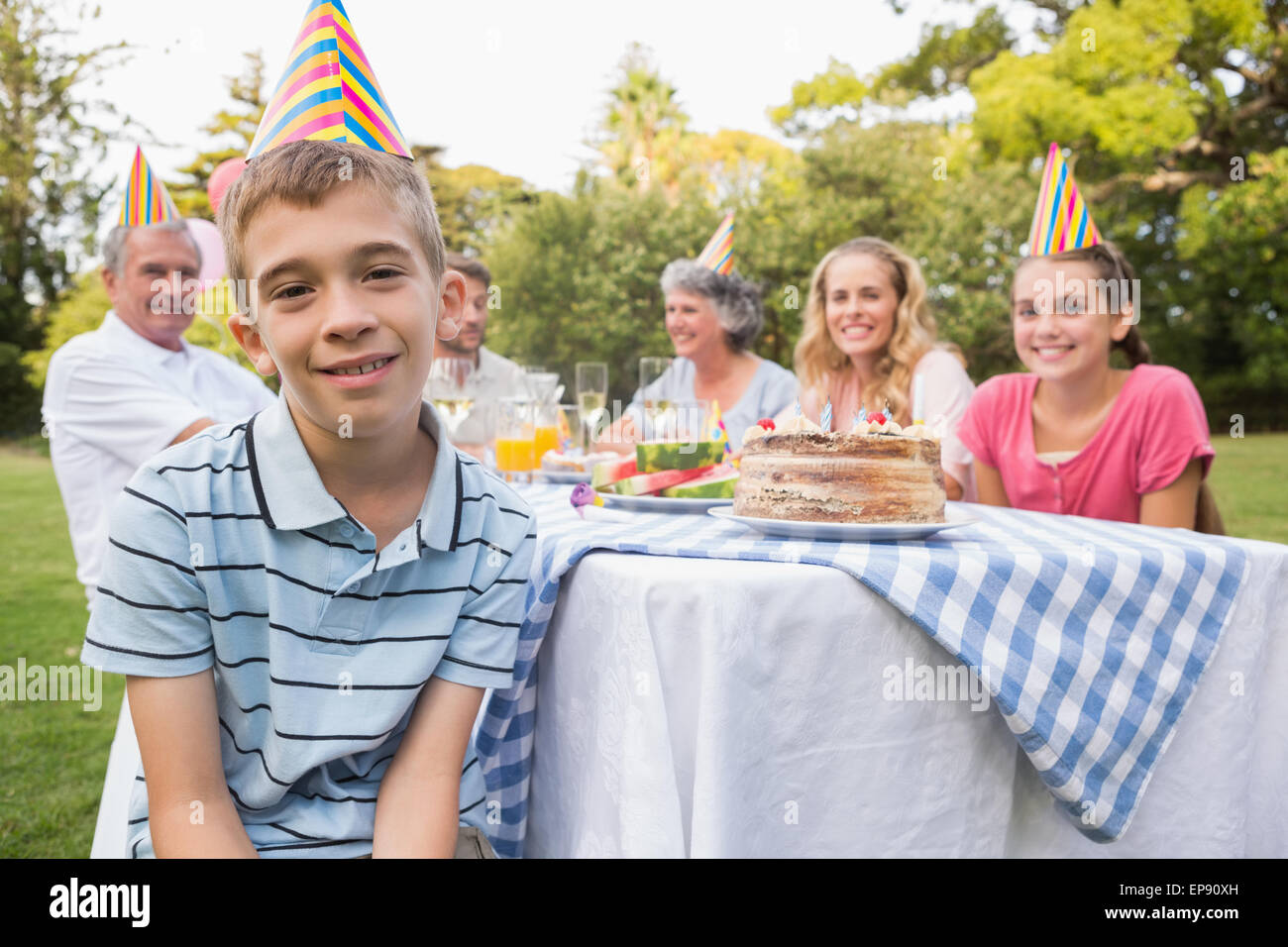 Little boy smiling at camera at his birthday party Stock Photo - Alamy