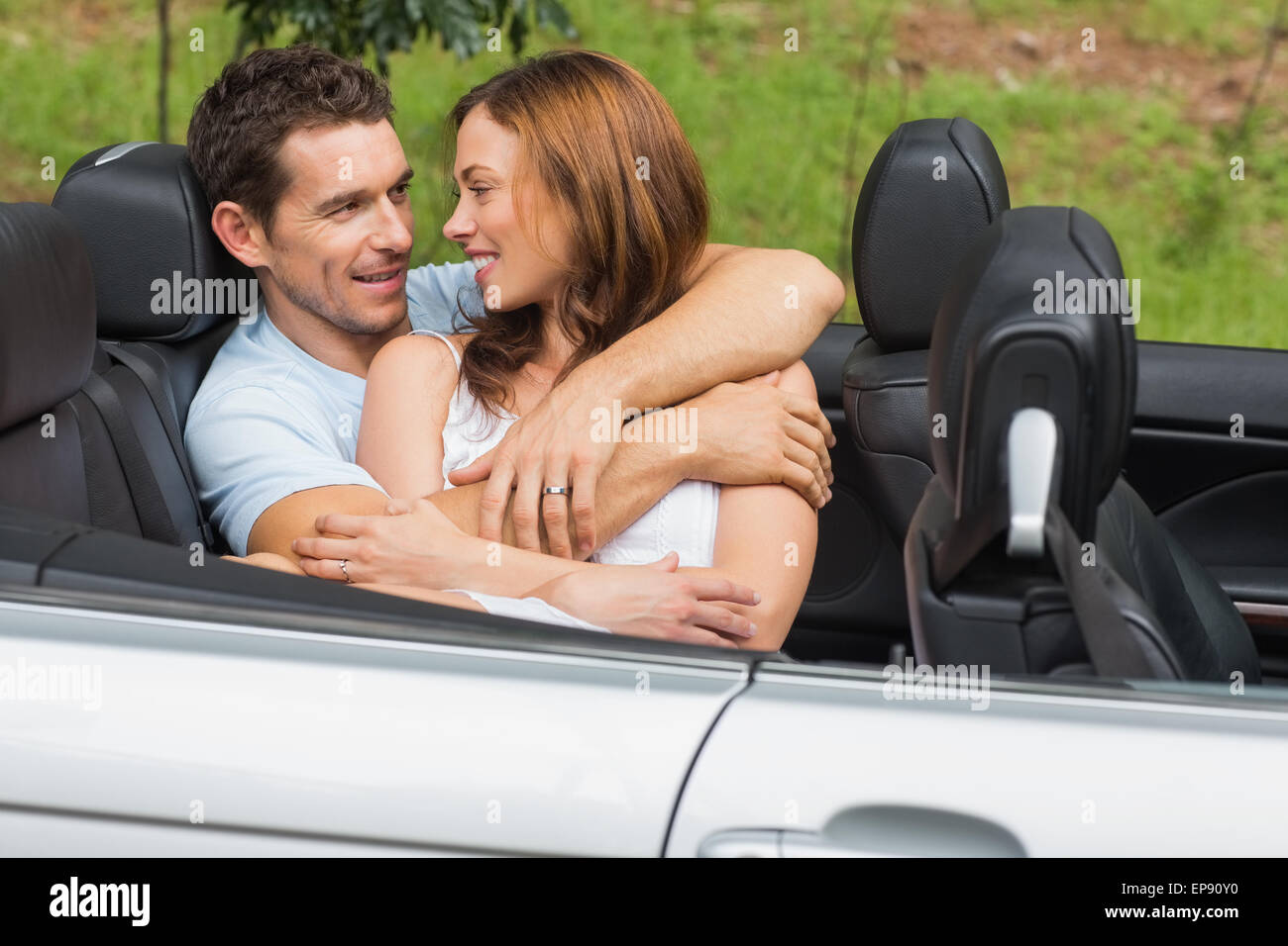Couple hugging in back seat hi-res stock photography and images - Alamy