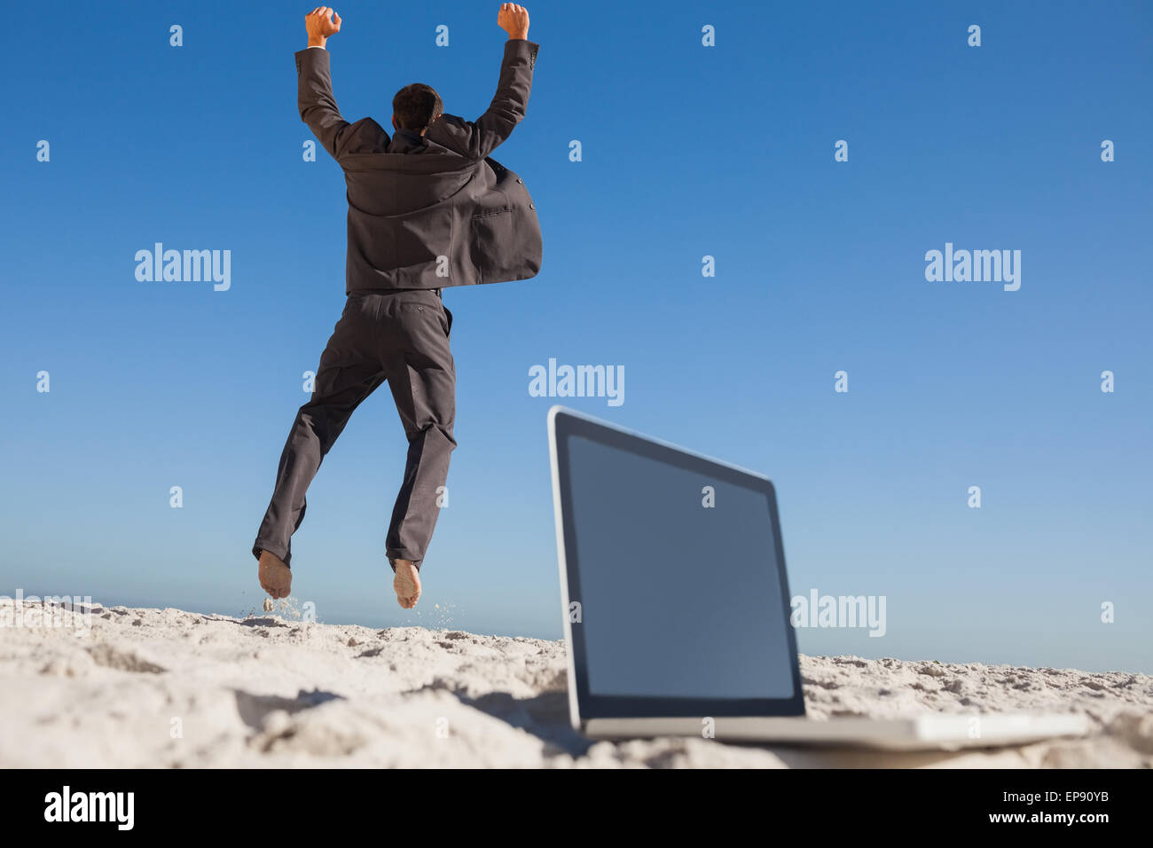Man suit jumping laptop hi-res stock photography and images - Alamy