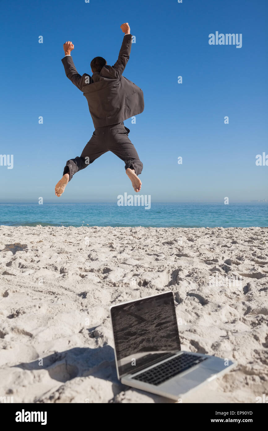 Man suit jumping laptop hi-res stock photography and images - Alamy